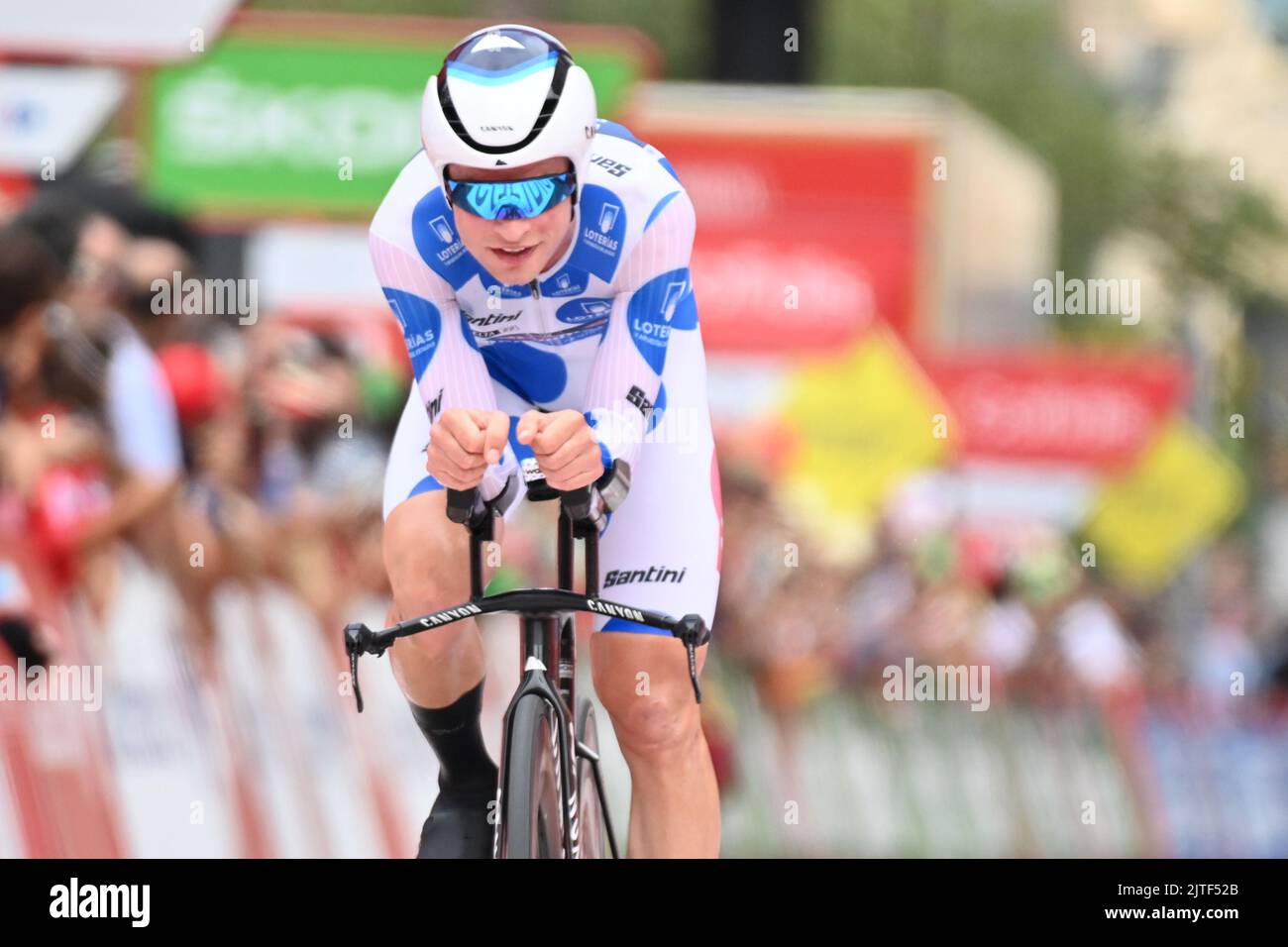 Australian Jay Vine of Alpecin-Fenix wearing the white and blue polka ...