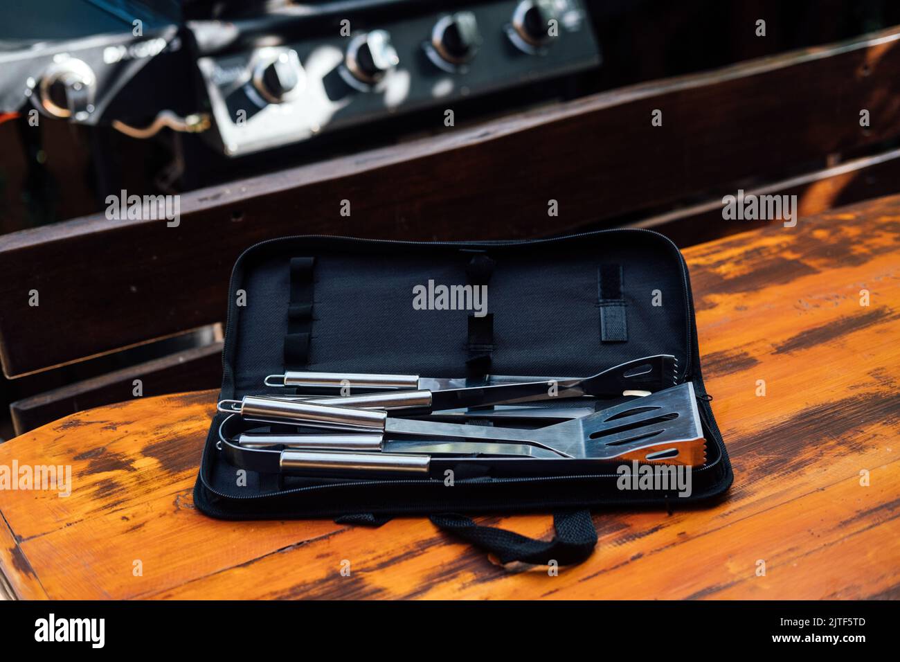 Grilling Tool Set on grill background. BBQ Utensils Set, Handle ...