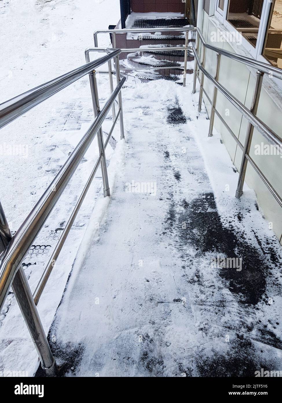 Modern ramp with metal railings for accessible movement of people with ...