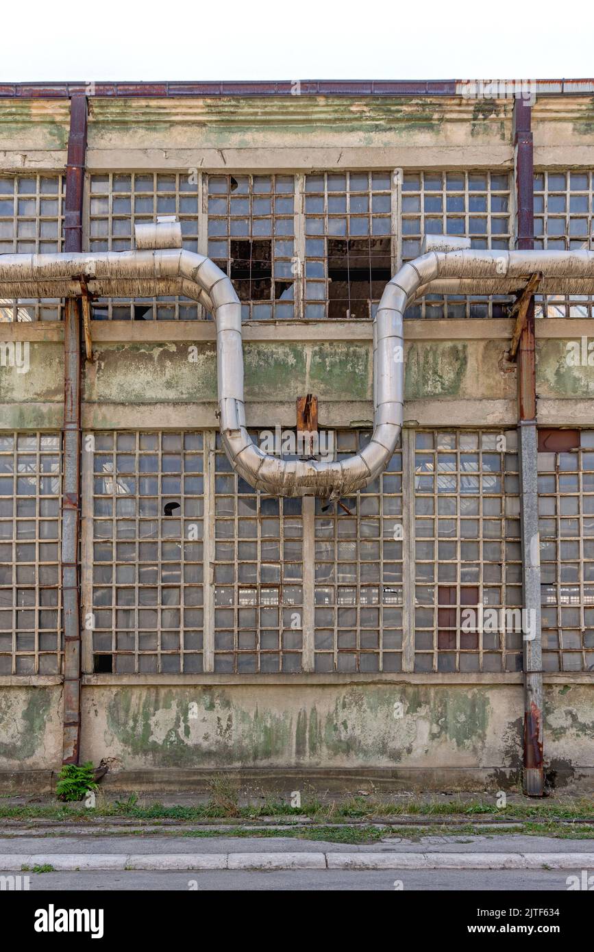 U Shape Bend at Steam Pipe Line in Old Factory Building Stock Photo - Alamy
