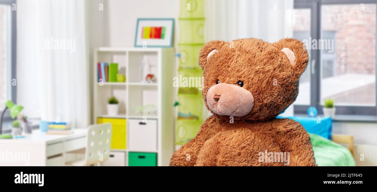 teddy bear toy over children's room background Stock Photo - Alamy