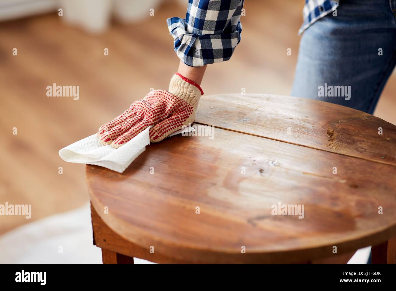 woman cleaning old table surface with paper tissue Stock Photo - Alamy