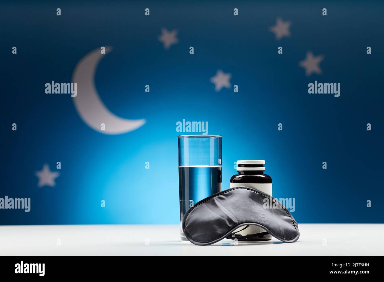 water, eye sleeping mask and medicine at night Stock Photo - Alamy