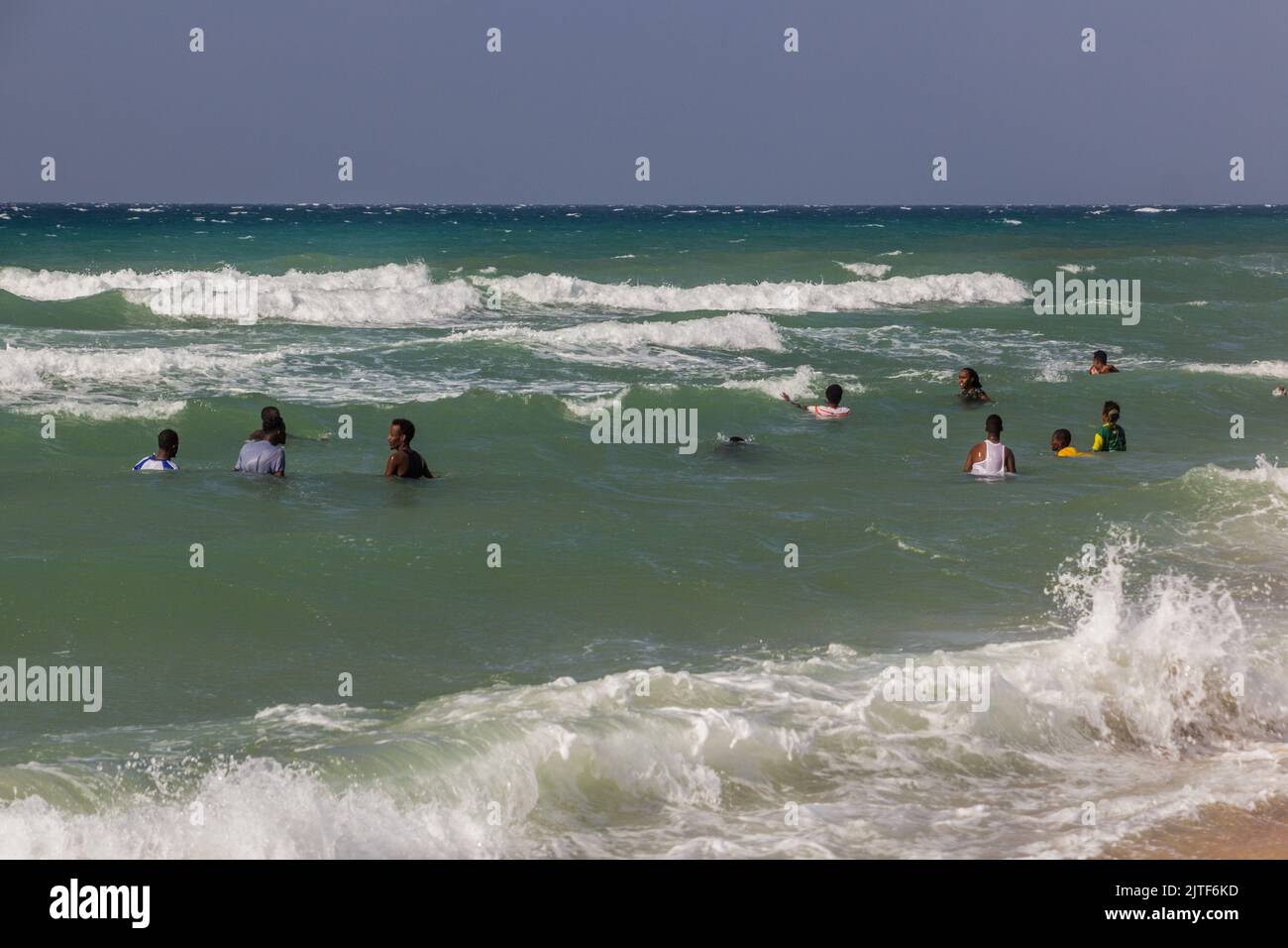 BERBERA, SOMALILAND - APRIL 13, 2019: People swimming in a sea near ...