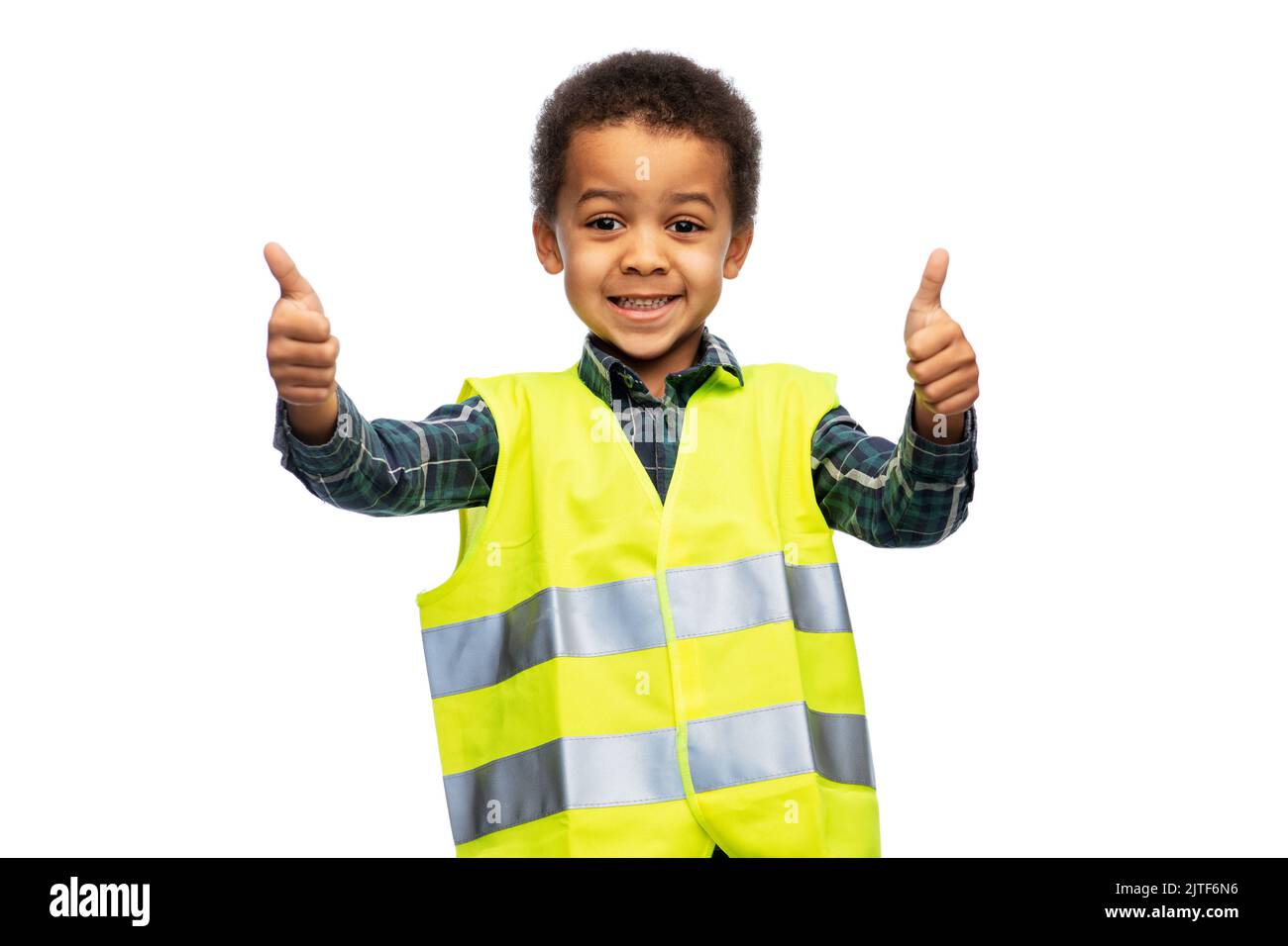 happy little boy in safety vest showing thumbs up Stock Photo - Alamy