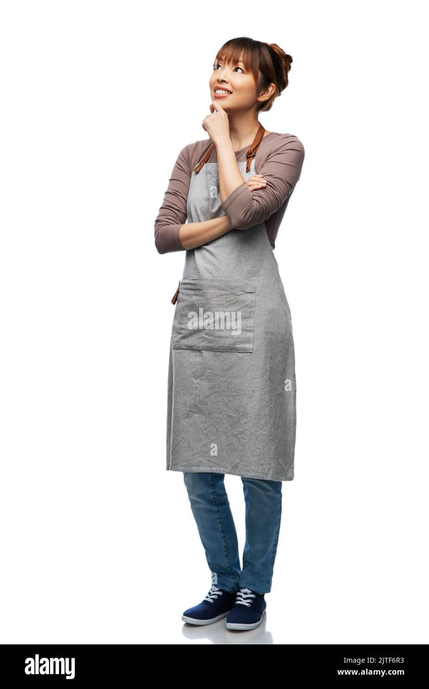 Thinking woman in apron hi-res stock photography and images - Alamy