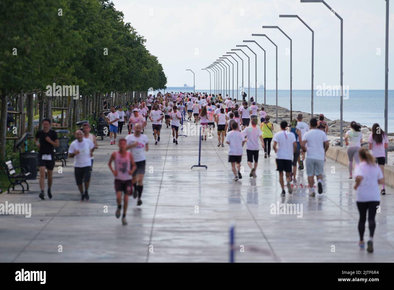 ISTANBUL, TURKIYE - JUNE 18, 2022: People running in colors during ...
