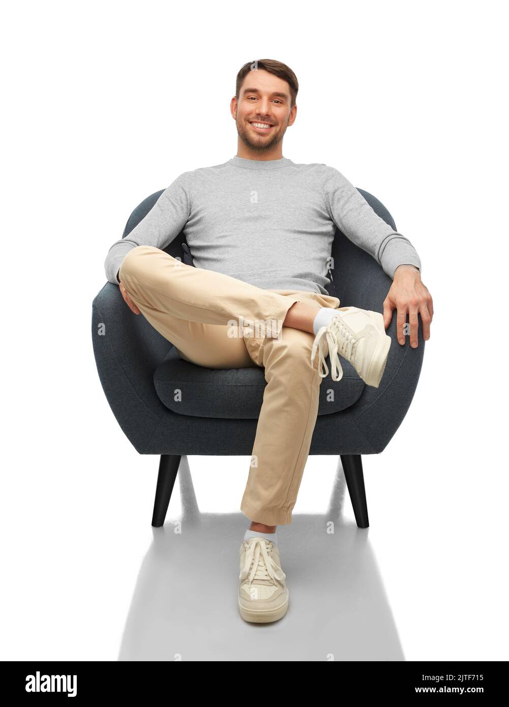 Man sitting chair studio shot hi-res stock photography and images - Alamy