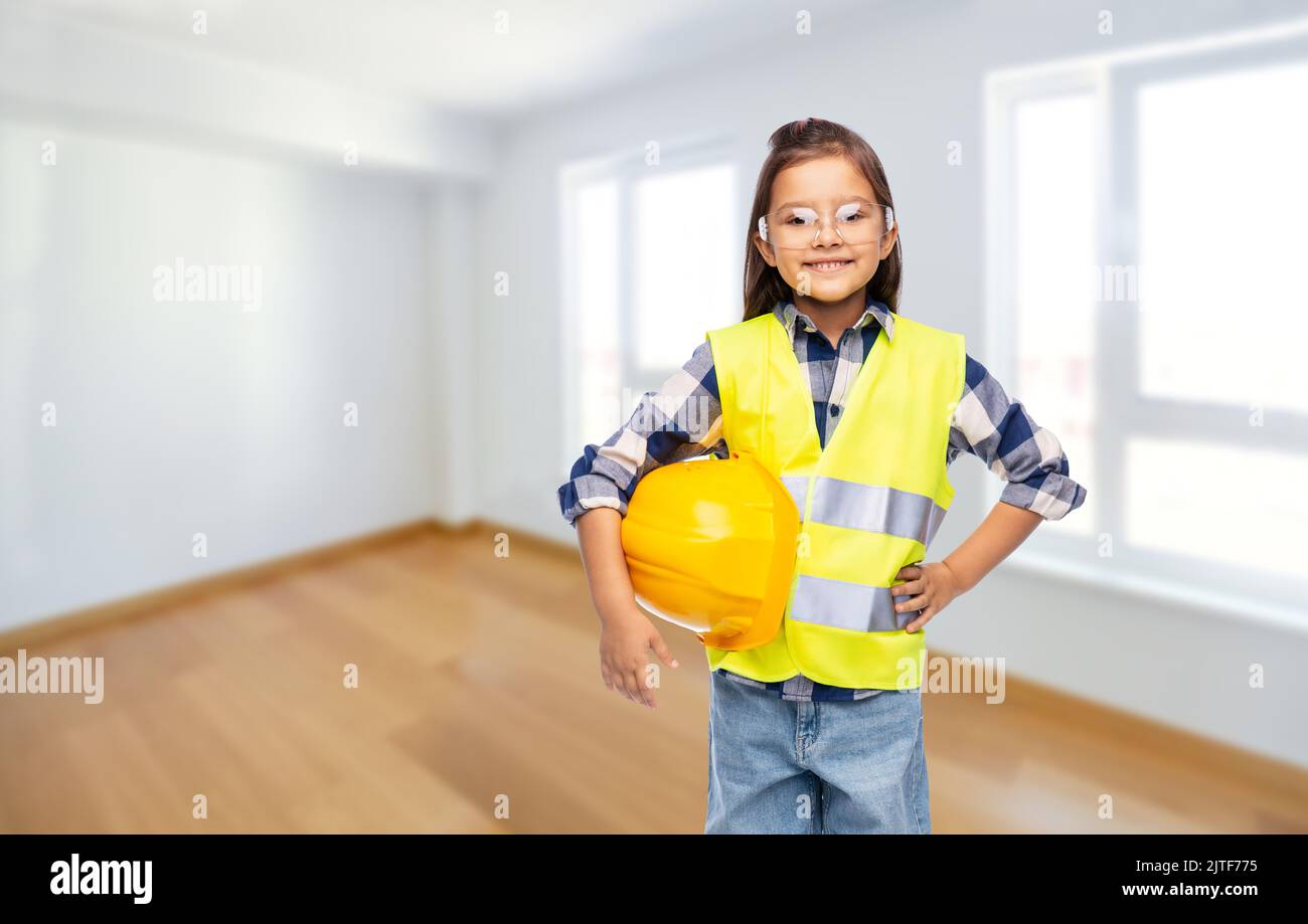 happy girl with helmet in safety vest and goggles Stock Photo - Alamy