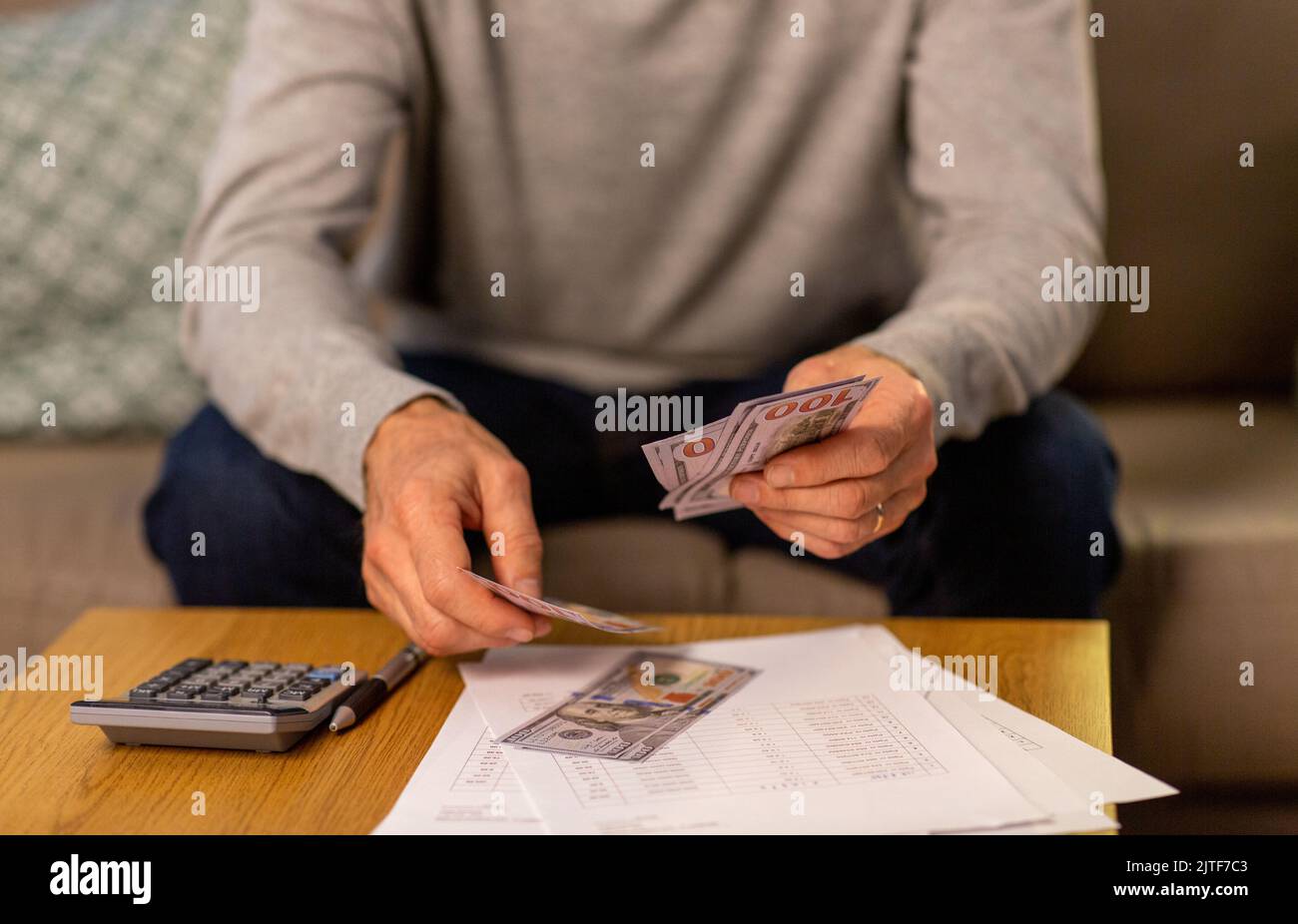 Old man saving money hi-res stock photography and images - Alamy