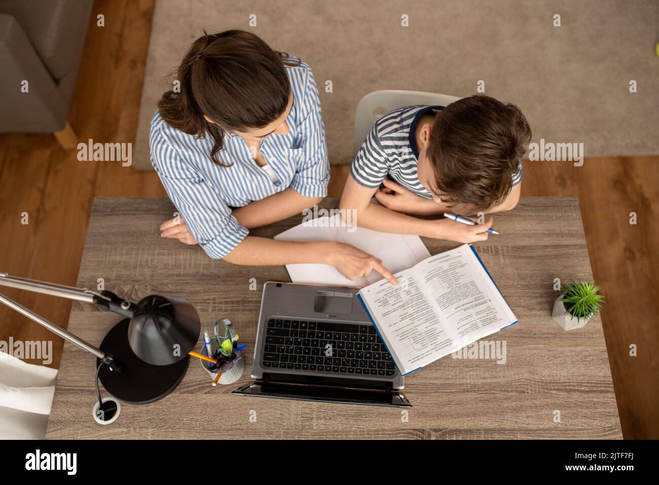 mother and son doing homework together Stock Photo - Alamy