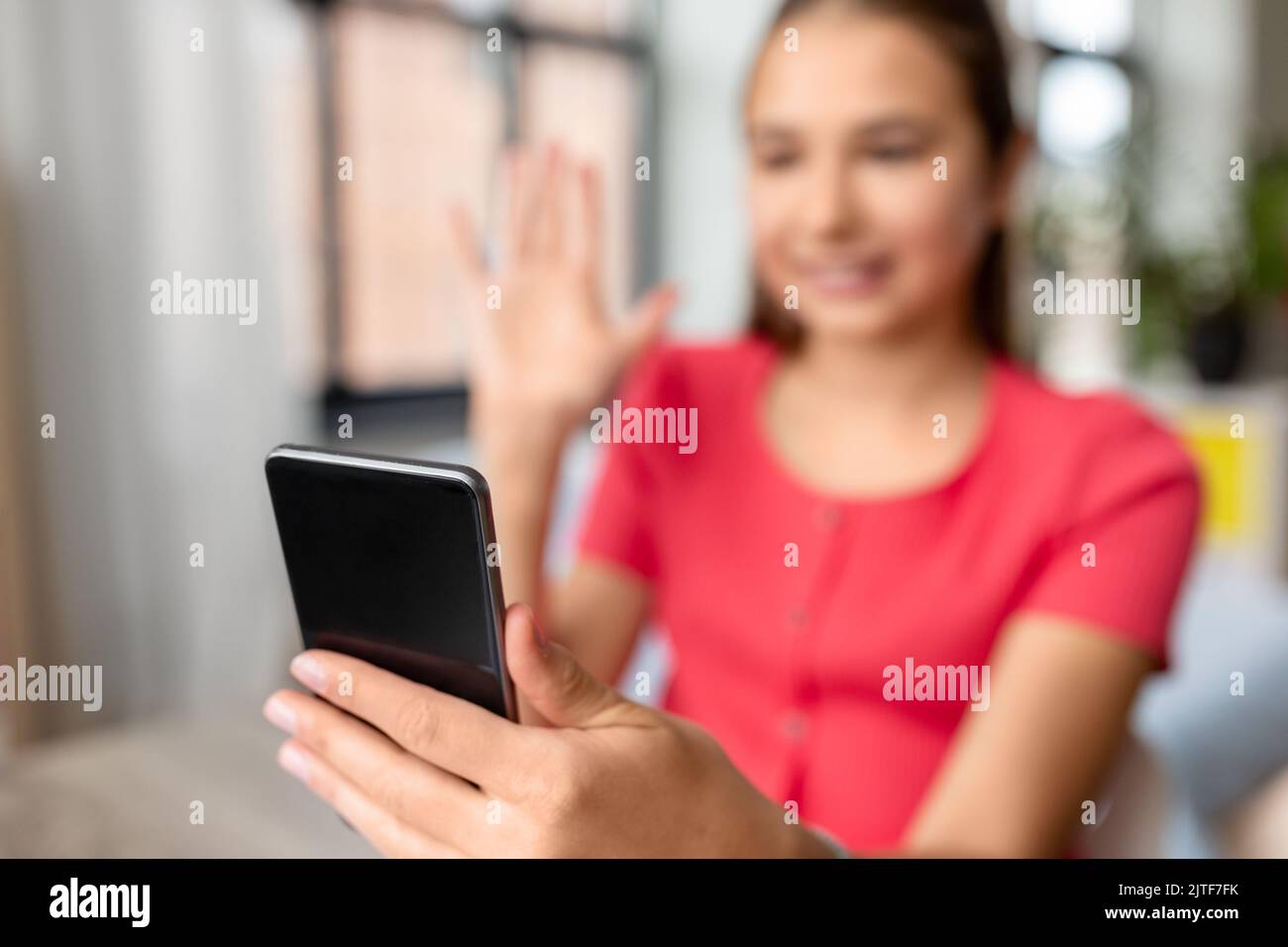 teenage girl with smartphone having video call Stock Photo - Alamy