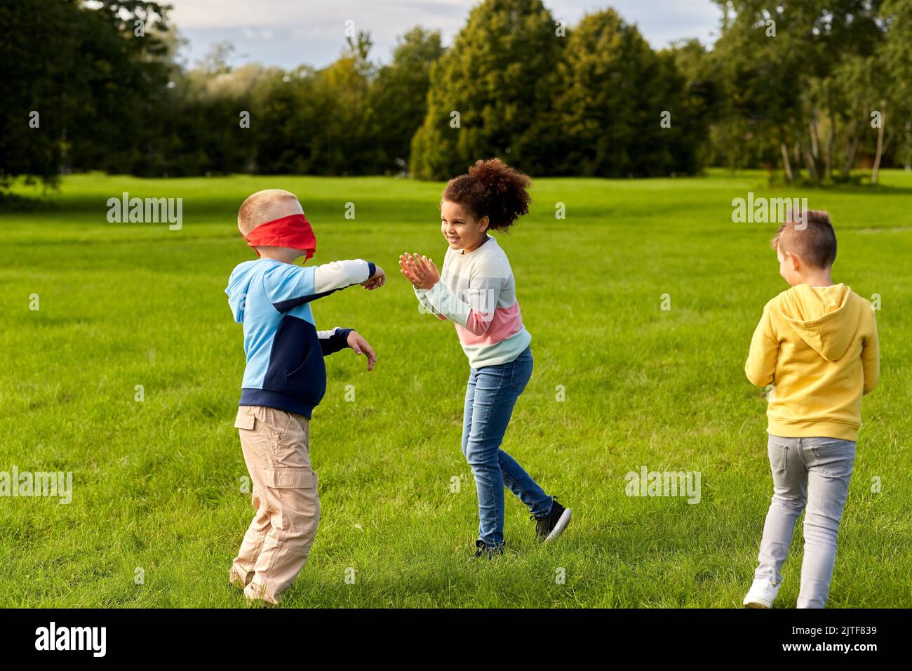 happy children playing and running at park Stock Photo - Alamy