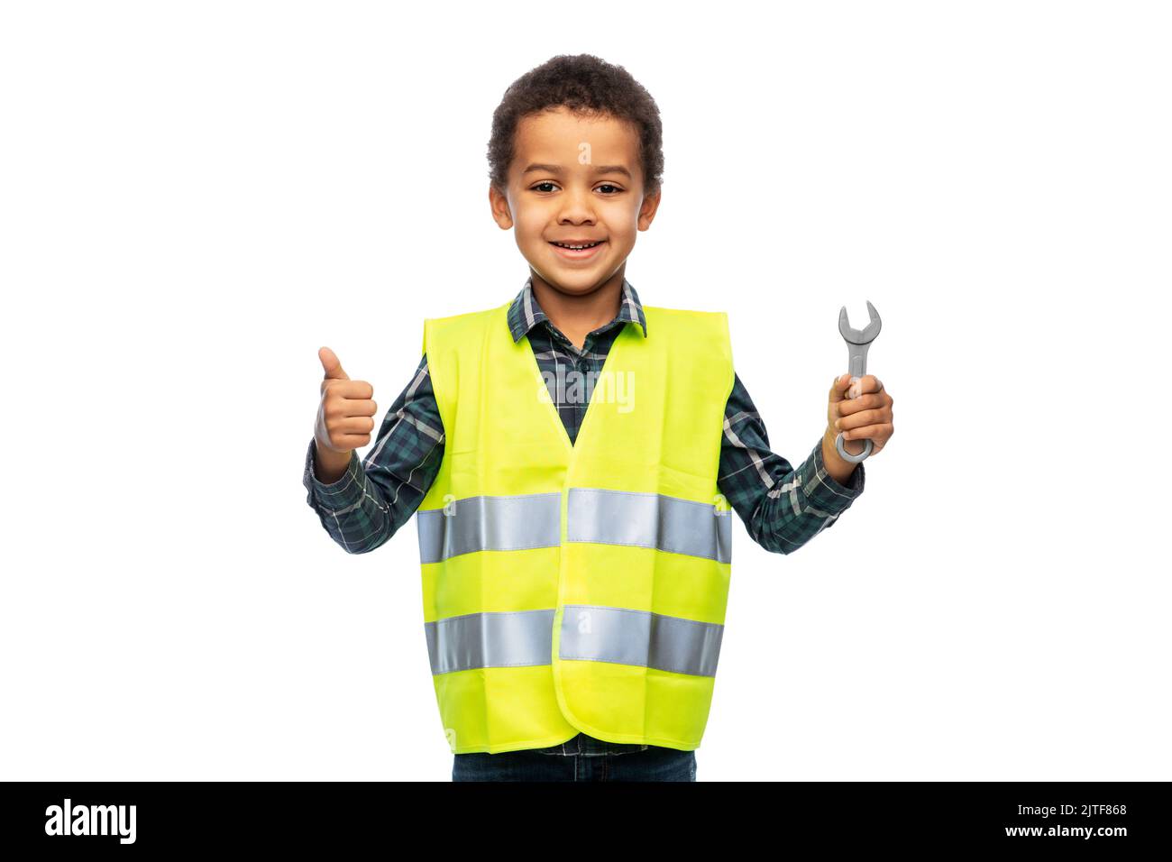 little boy in safety vest with wrench Stock Photo - Alamy