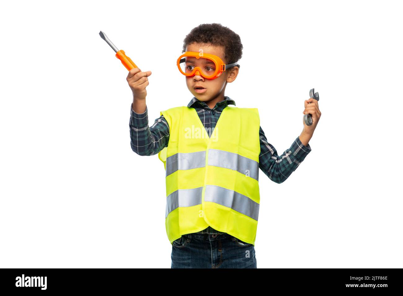 little boy in safety vest with screwdrivers Stock Photo - Alamy