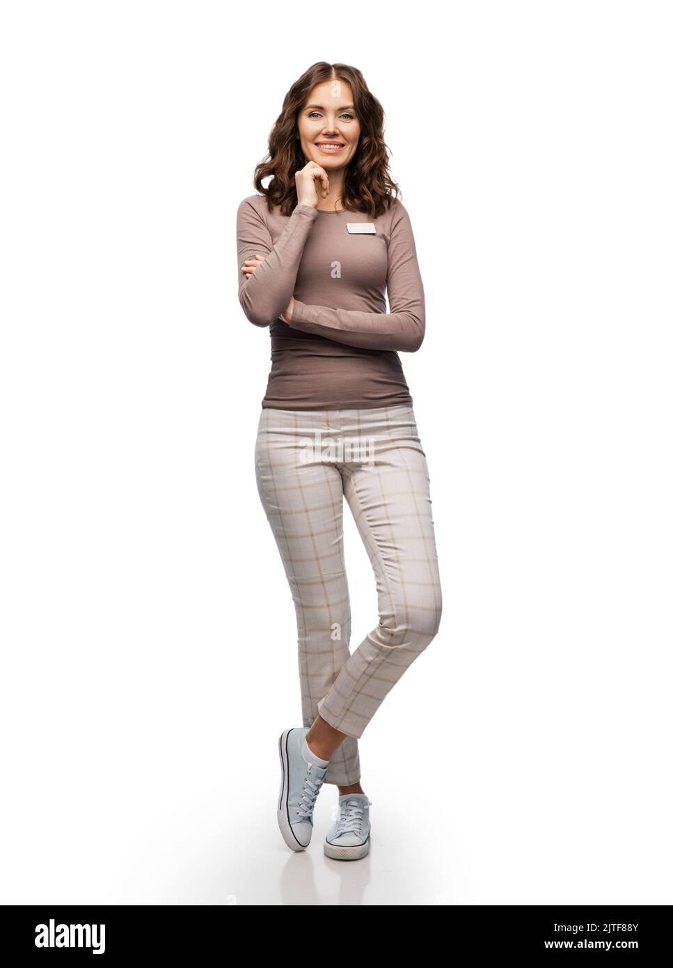 happy female shop assistant with name tag Stock Photo - Alamy