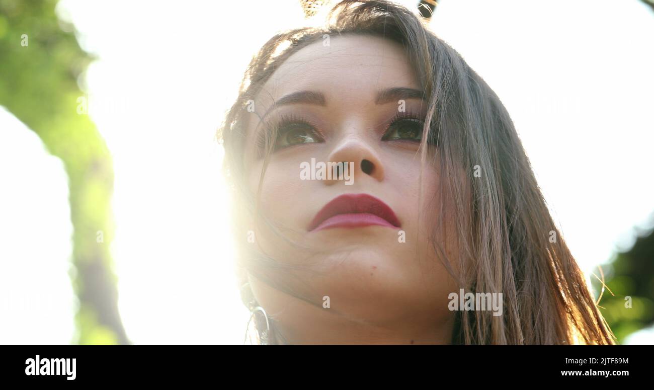 Portrait of young woman posing outside. Pretty girl face in outdoors ...