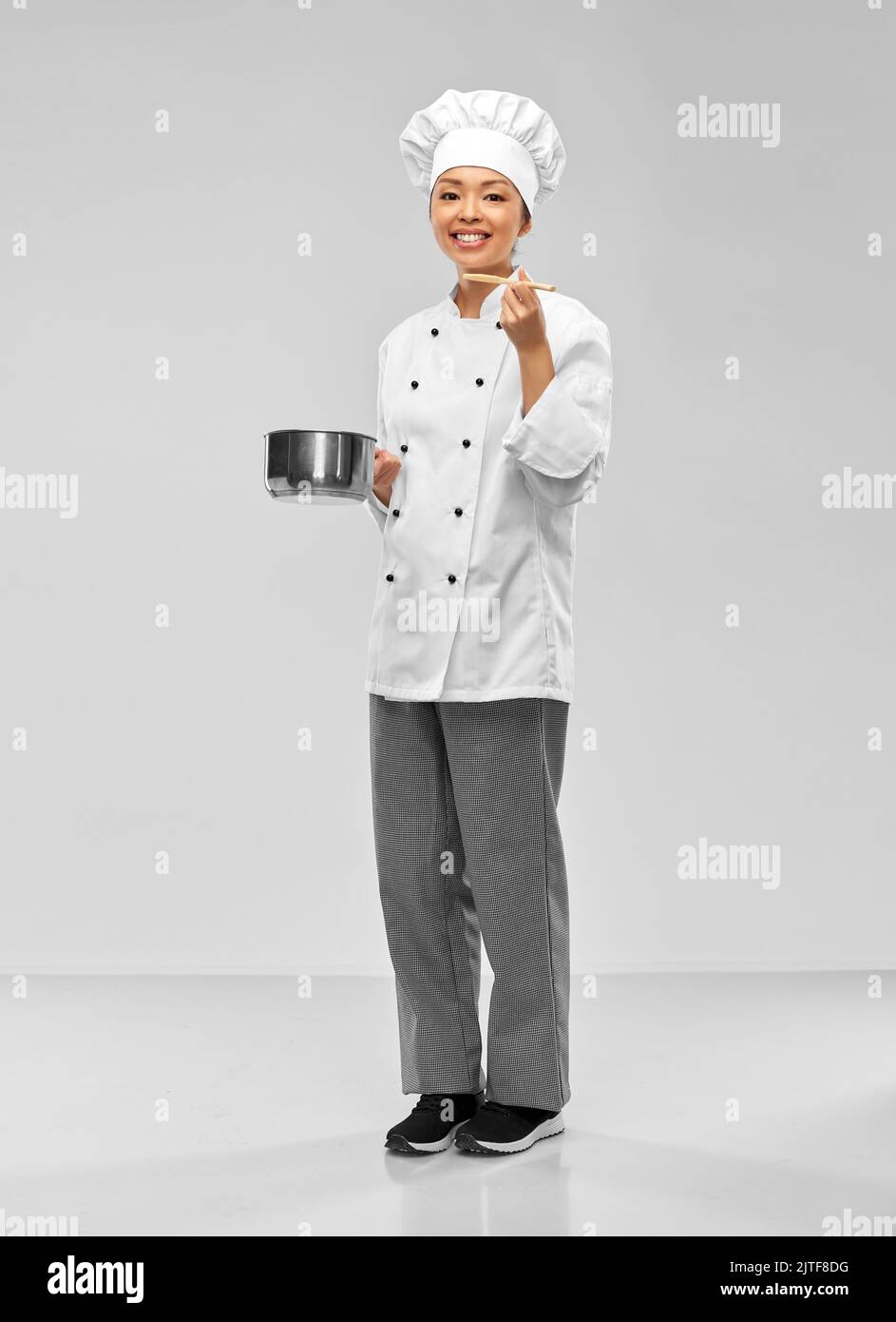happy smiling female chef with saucepan Stock Photo - Alamy