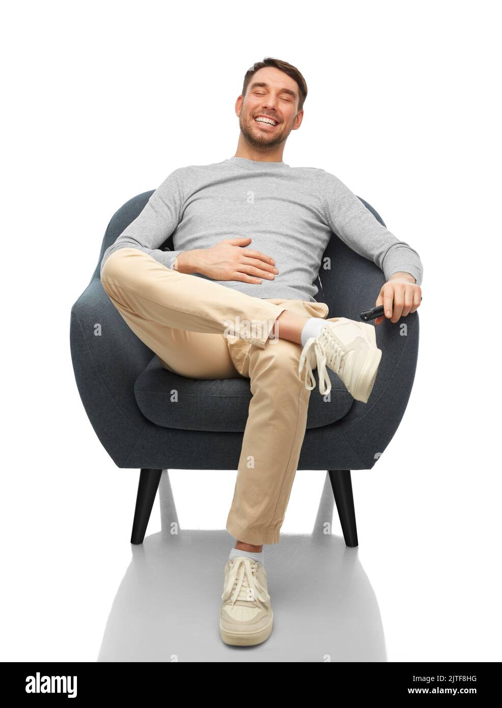 Young man sitting in armchair hi-res stock photography and images - Alamy