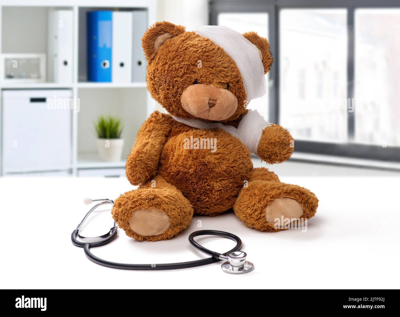 bandaged teddy bear toy with stethoscope Stock Photo - Alamy