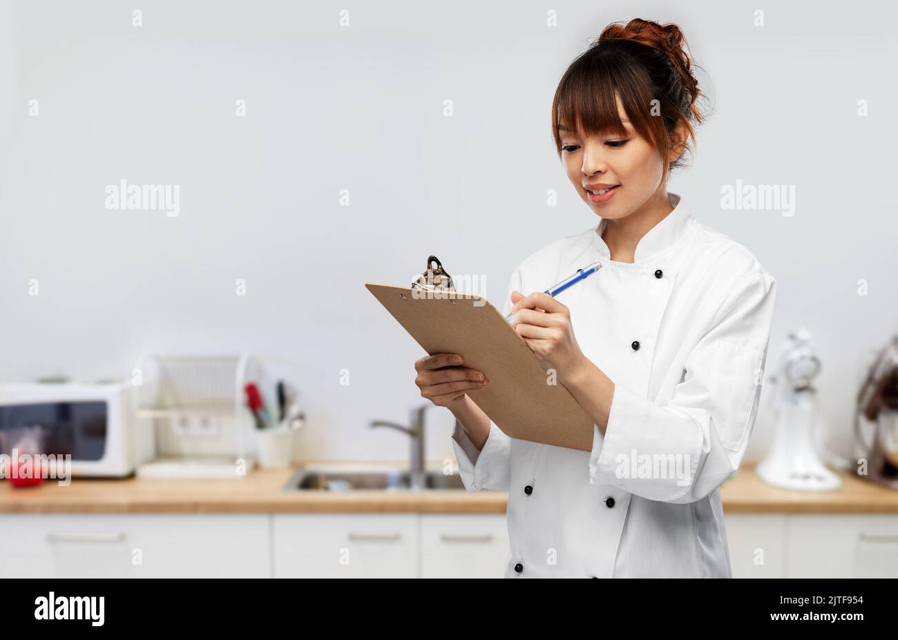 Beautiful female chef cooking kitchen hi-res stock photography and ...