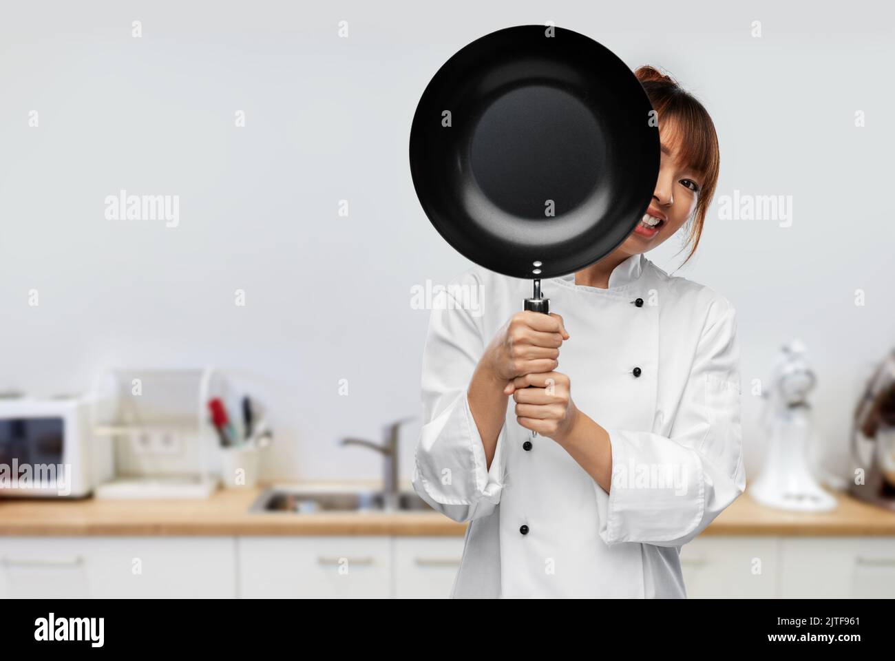 Female cook from behind hi-res stock photography and images - Alamy
