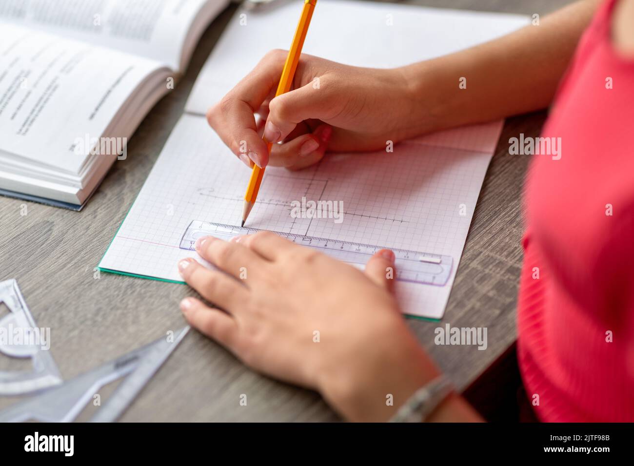 student with ruler and pencil drawing in notebook Stock Photo - Alamy