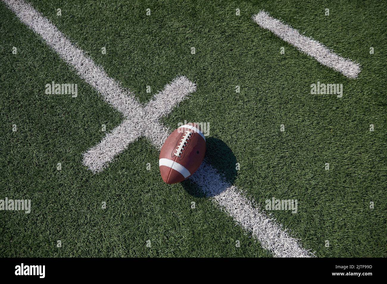 Overhead view of American football ball on field Stock Photo - Alamy