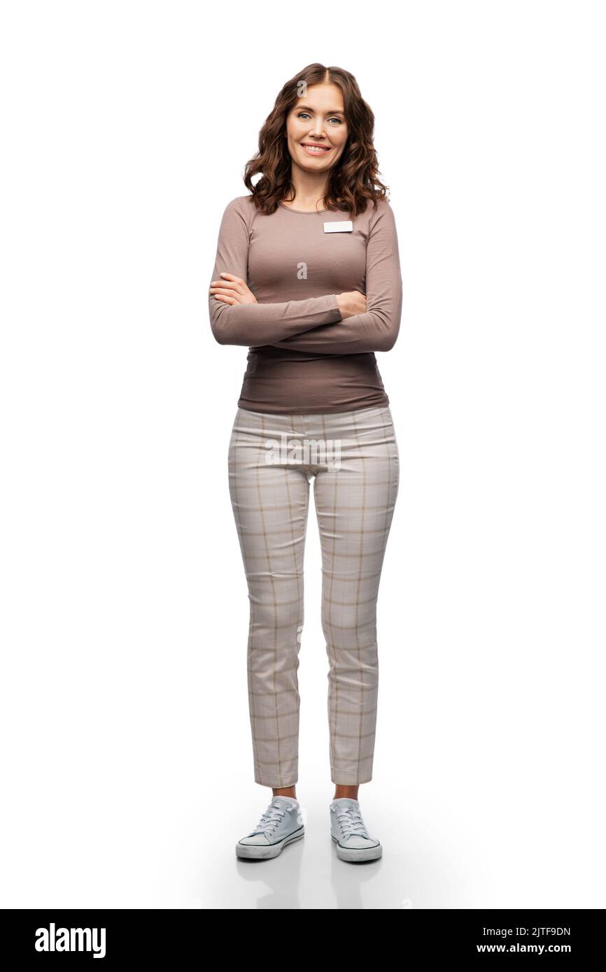 happy female shop assistant with name tag Stock Photo - Alamy