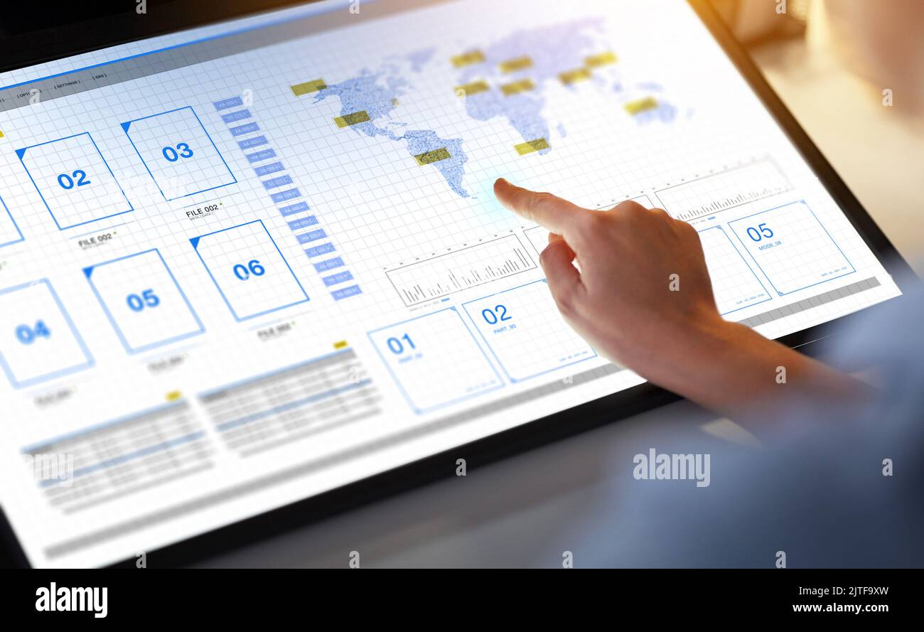 hand on led light tablet at night office Stock Photo - Alamy