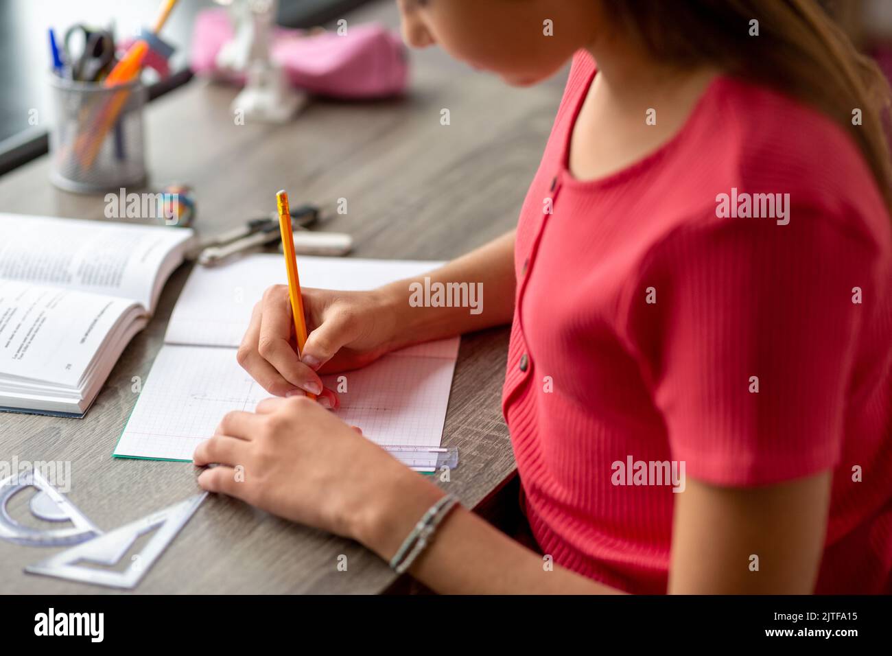student with ruler and pencil drawing in notebook Stock Photo - Alamy