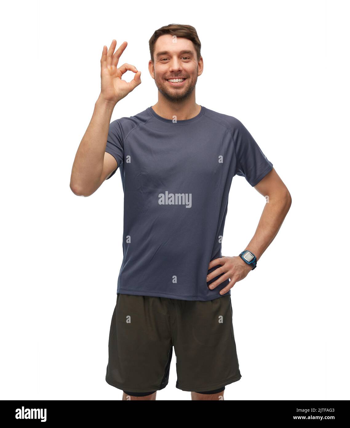 smiling man with smart watch showing ok sign Stock Photo - Alamy