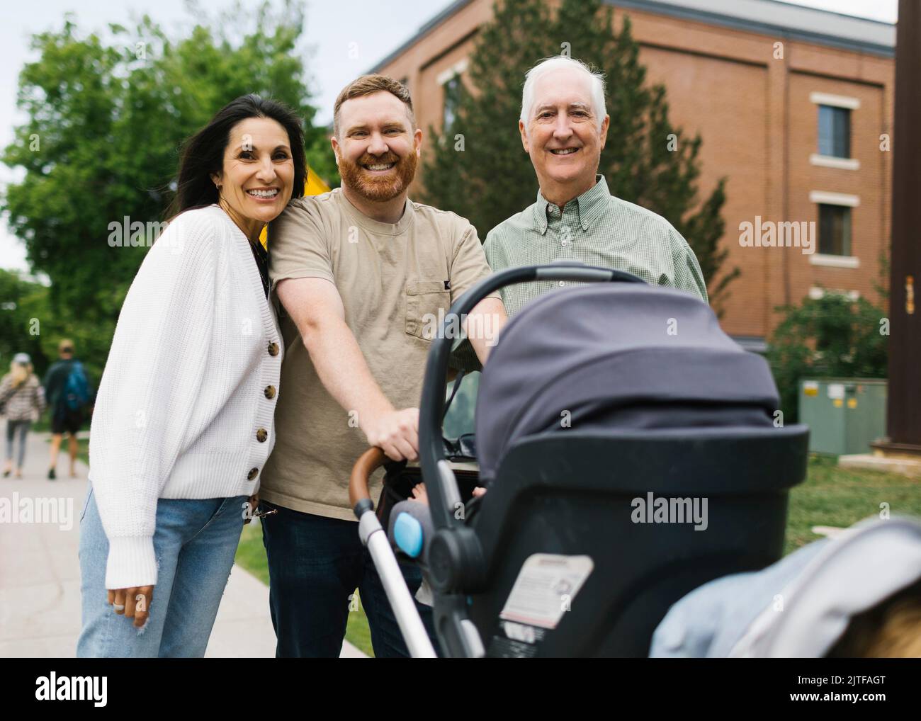 Family with stroller hi-res stock photography and images - Alamy