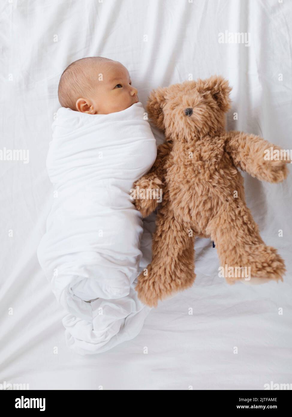 Newborn baby boy (0-1 months) with teddy bear Stock Photo - Alamy