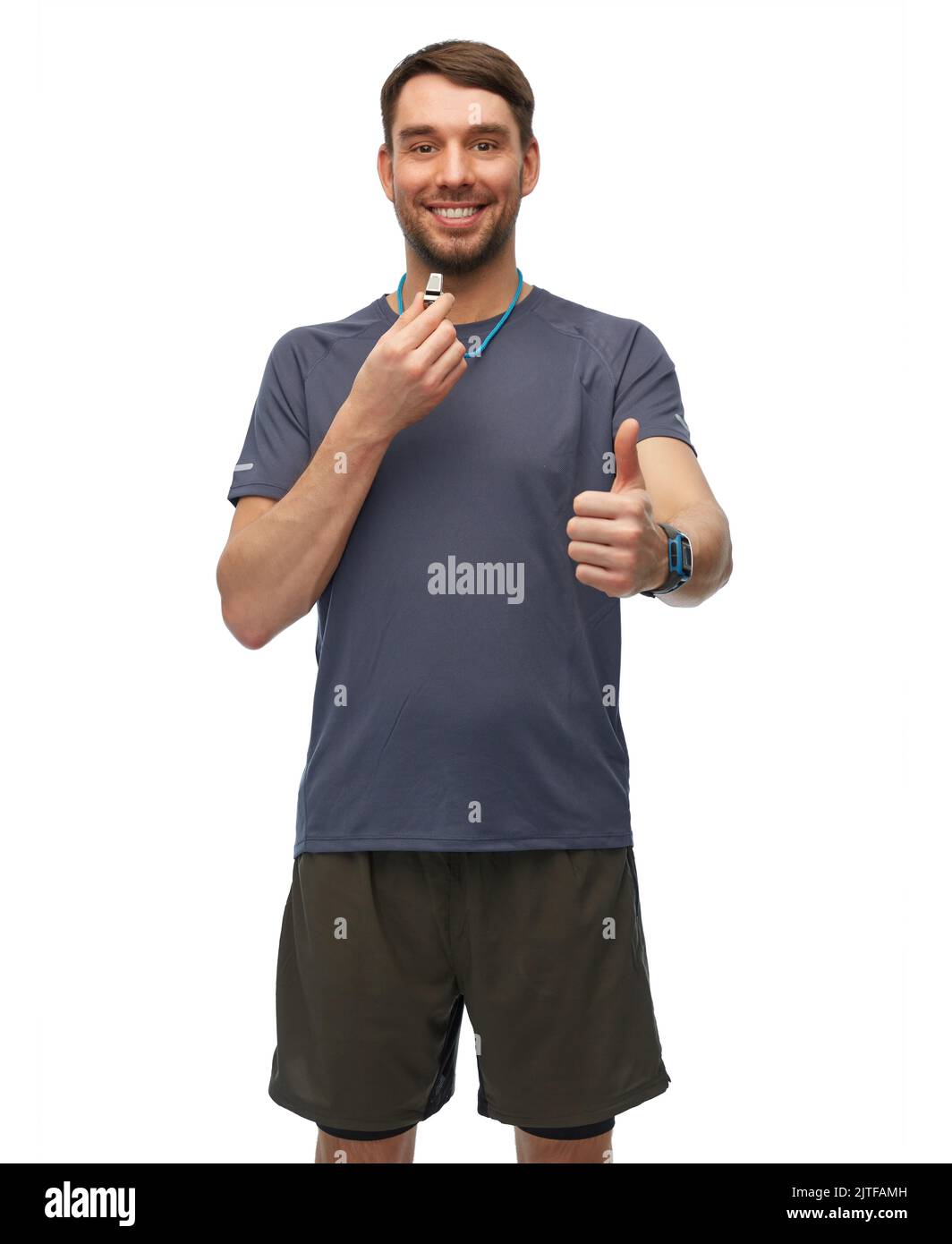 trainer or referee with whistle showing thumbs up Stock Photo - Alamy