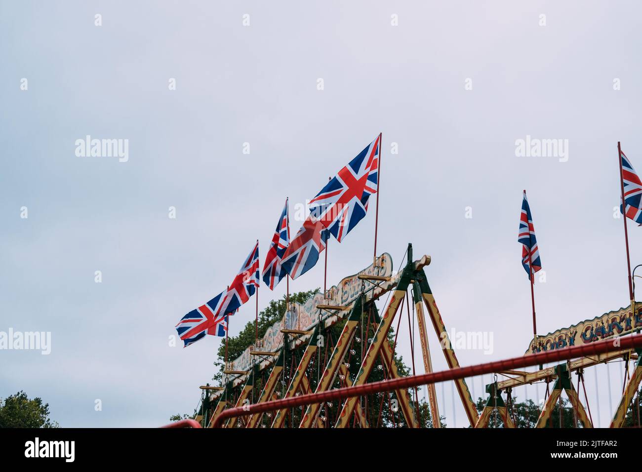 Union Jack flags at Carters funfair, bath, uk (Aug22 Stock Photo - Alamy