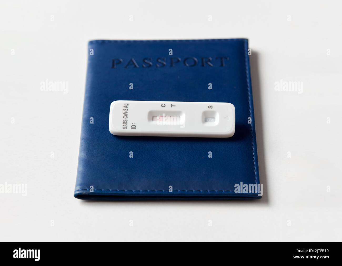 negative coronavirus test and passport on white Stock Photo - Alamy