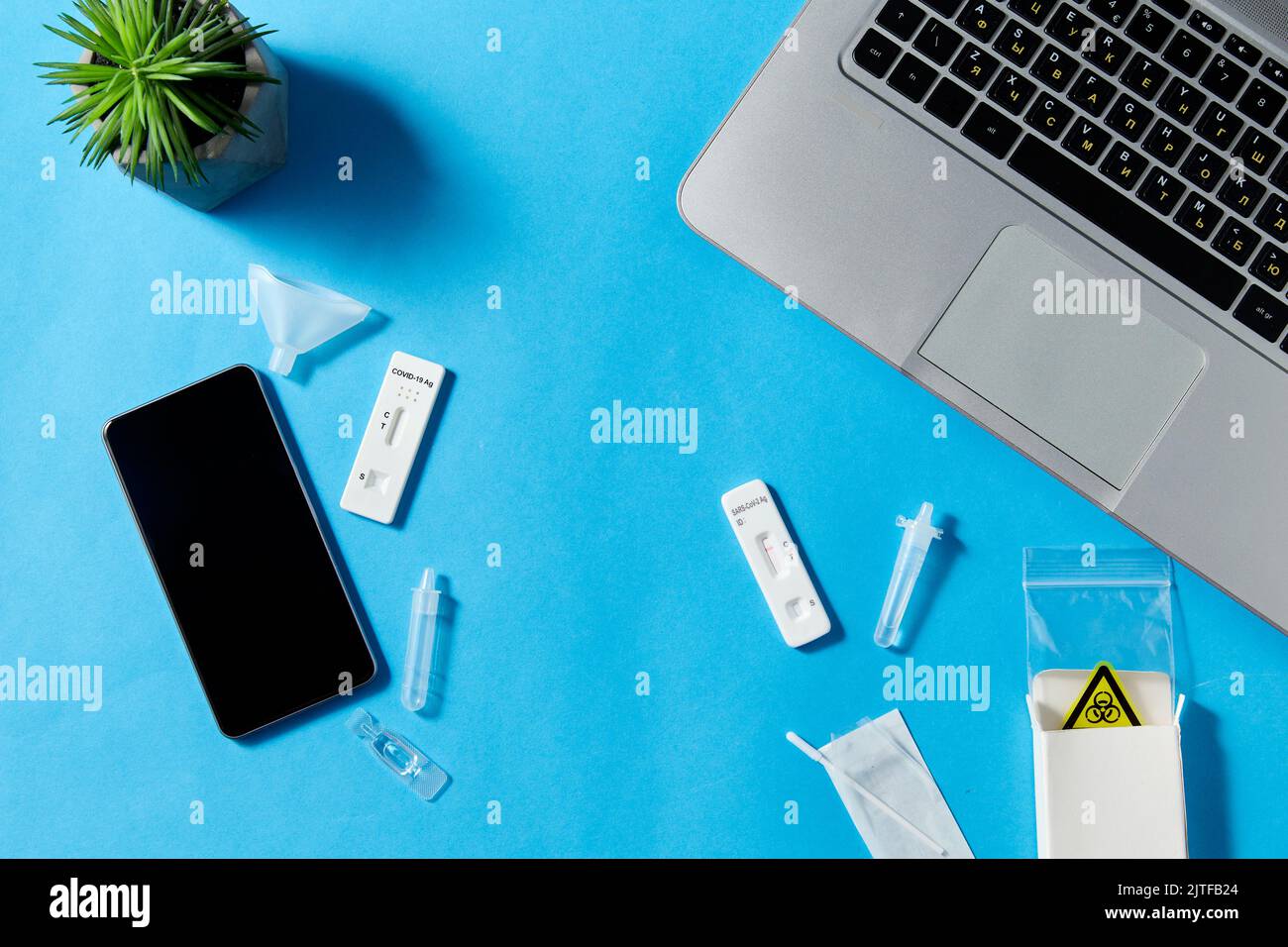 coronavirus self testing kits, laptop and phone Stock Photo - Alamy