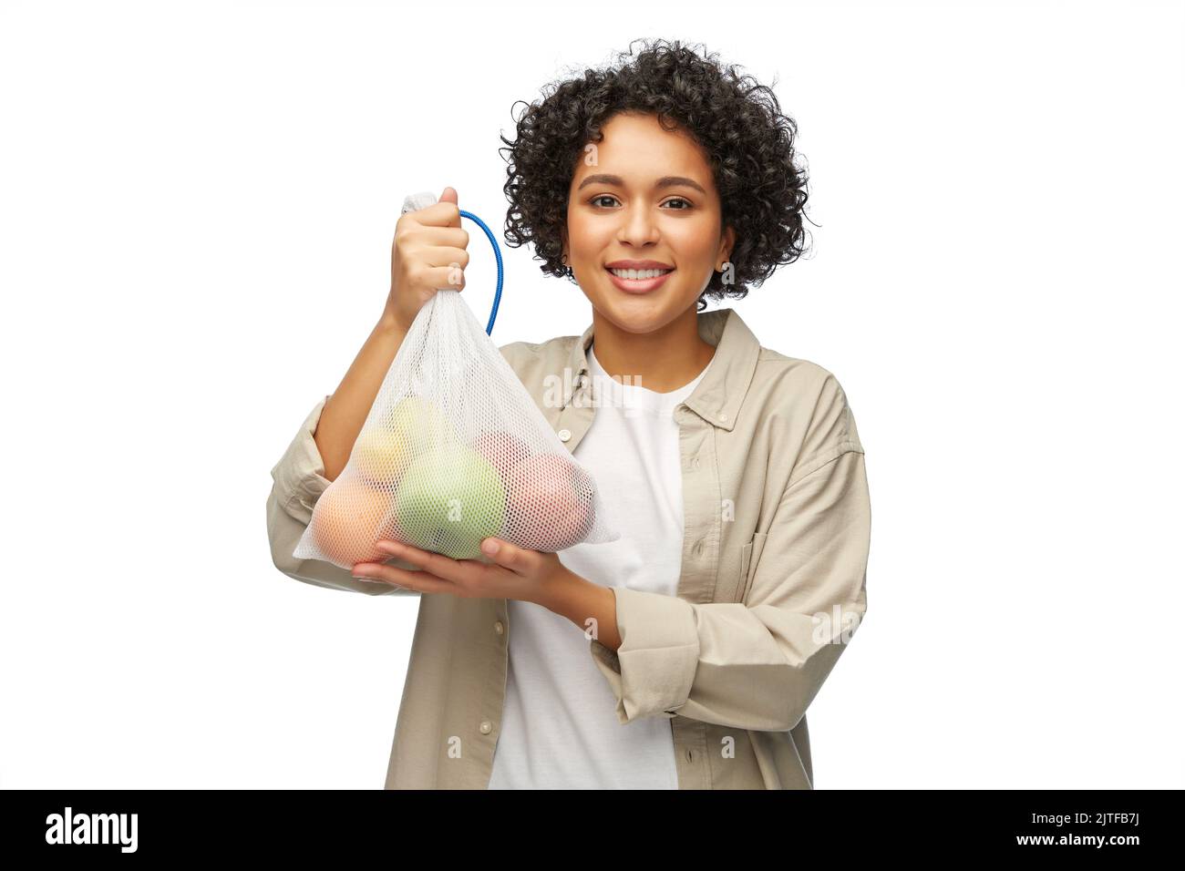 happy woman with fruits in reusable string bag Stock Photo - Alamy