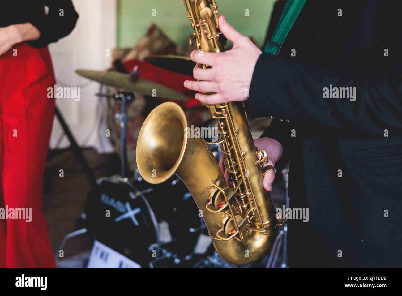 Concert view of saxophonist, a saxophone sax player with vocalist and ...