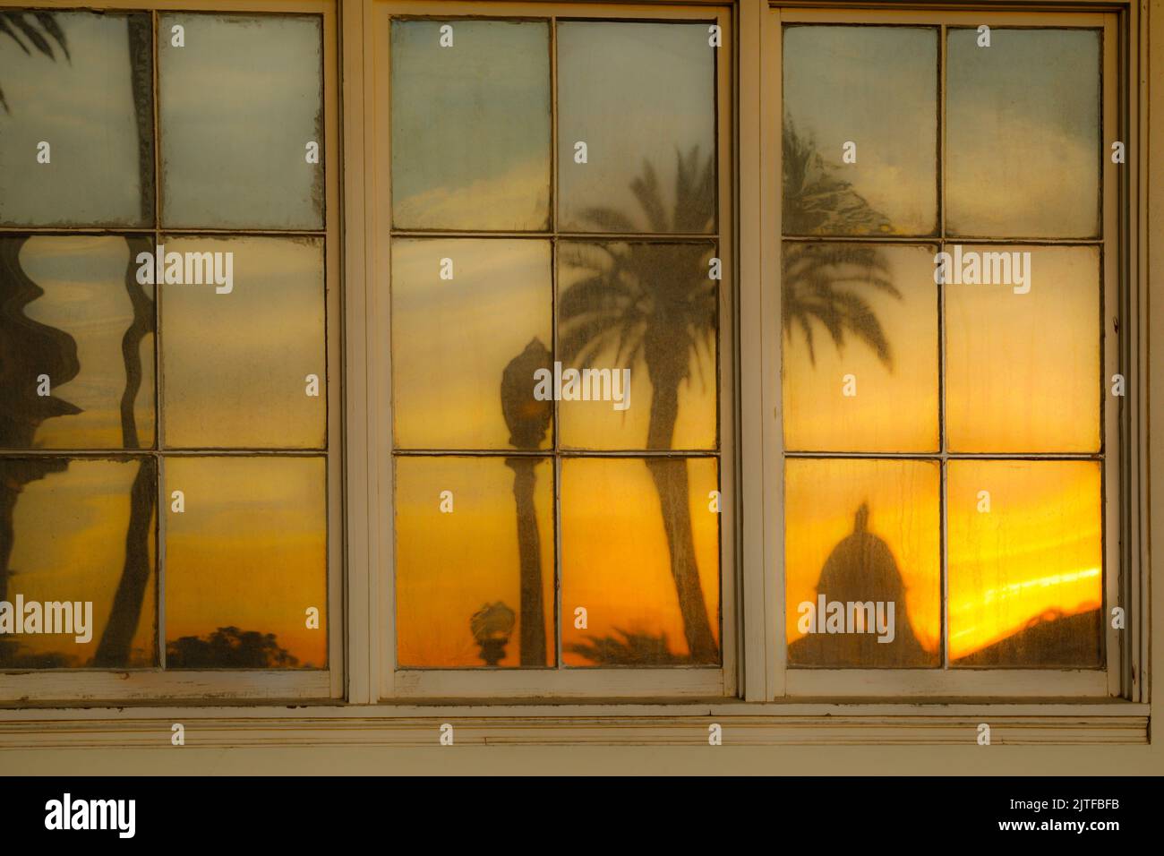 United States, California, Redlands, Sunset reflecting in window Stock ...