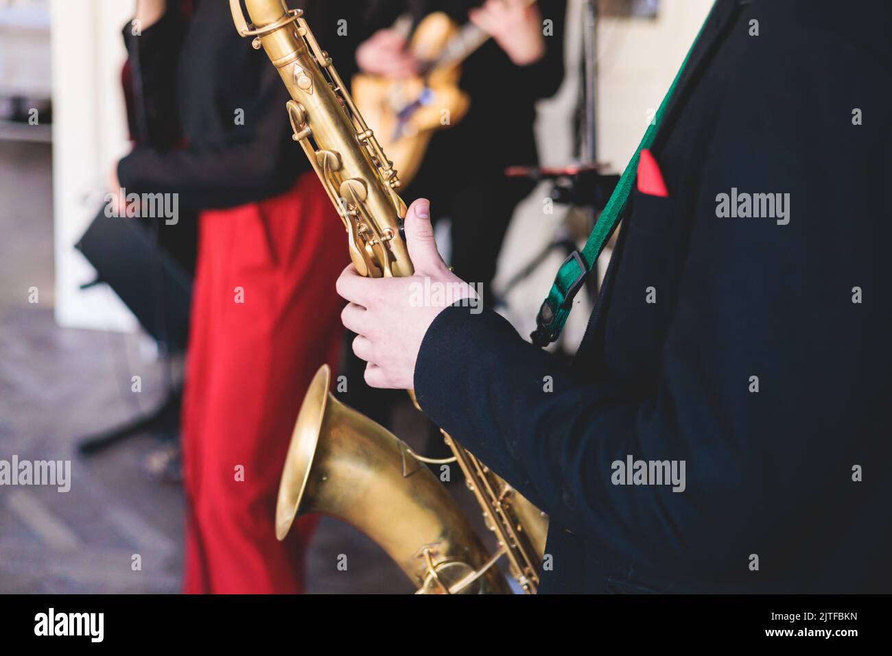 Concert view of saxophonist, a saxophone sax player with vocalist and ...