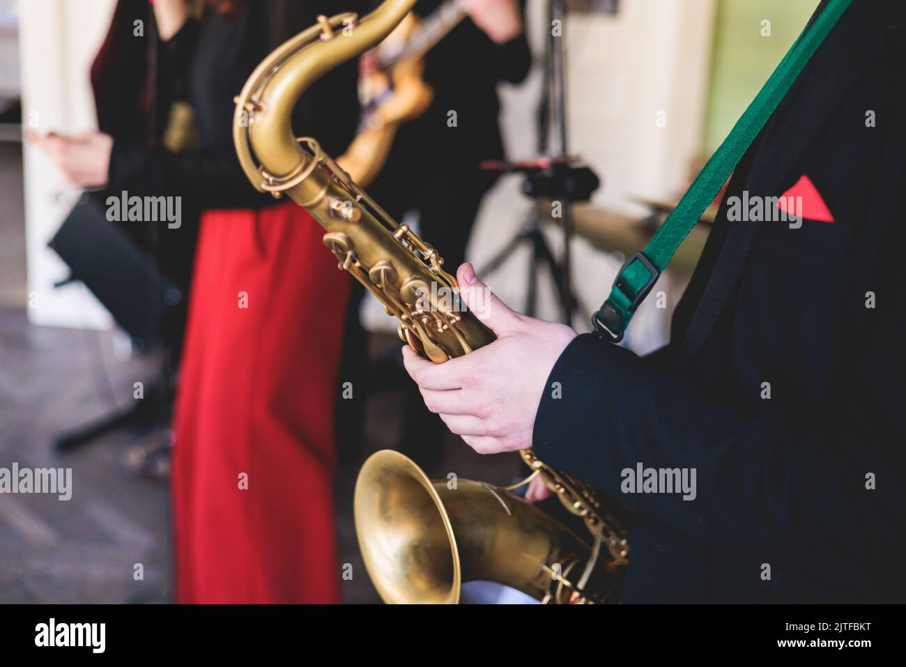 Concert view of saxophonist, a saxophone sax player with vocalist and ...