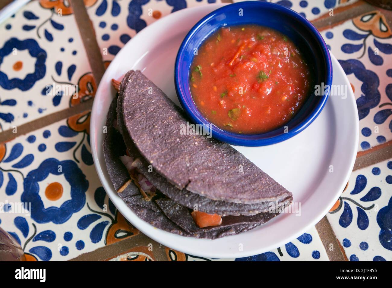 Taco with salsa on plate Stock Photo - Alamy