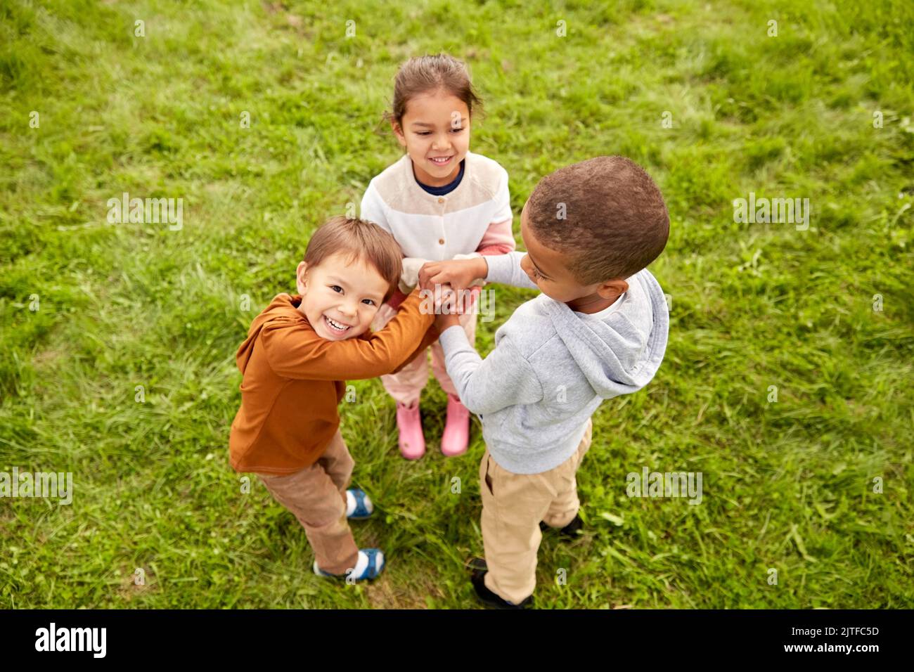 group of children playing game at park Stock Photo - Alamy