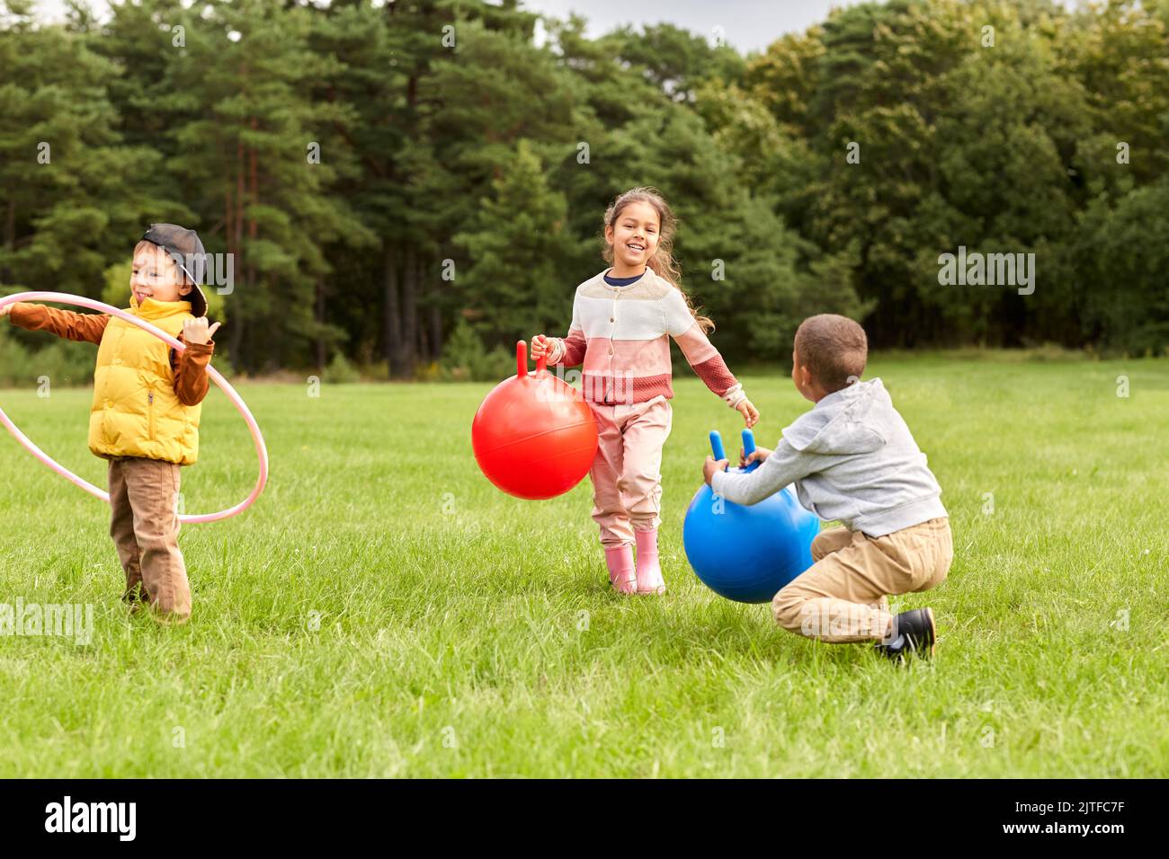Happy kid hula hoop african american hi-res stock photography and ...