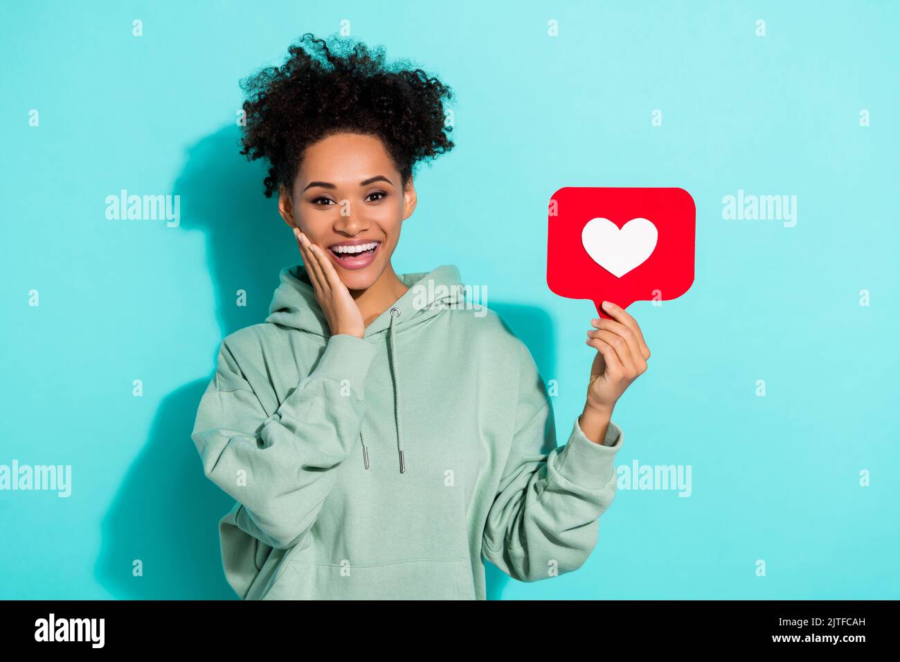 Photo of crazy funny person hand touch cheek hold paper like card ...