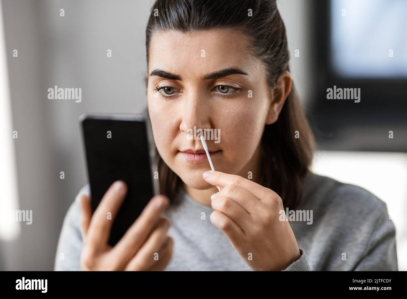Woman making self testing hi-res stock photography and images - Alamy