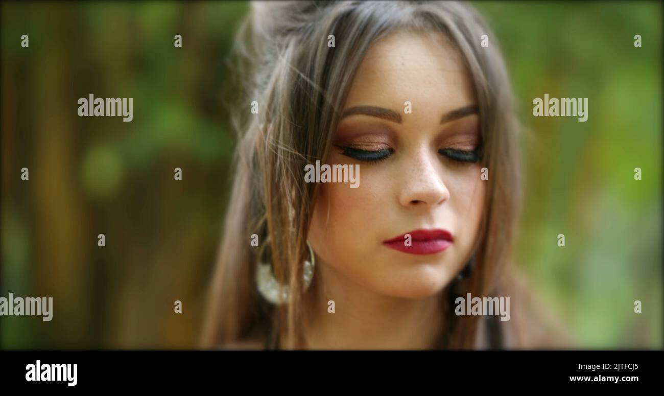Pretty Hispanic Girl Adjusting Hair Posing To Camera Young Millennial Woman In Hero 20s In