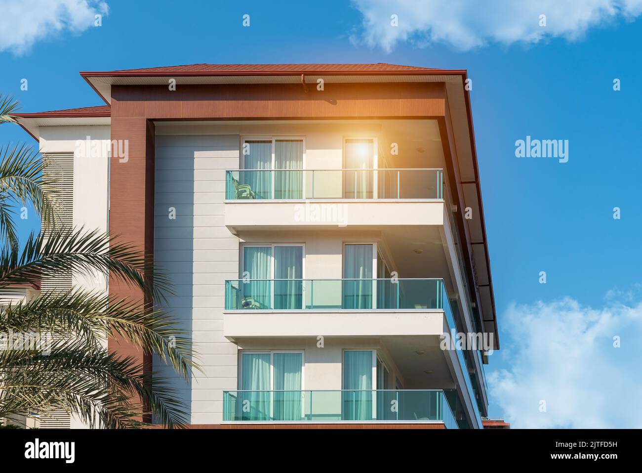 The exterior of an apartment building against the sky. Residential real ...